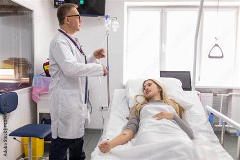Doctor Working Checking Intravenous Drip Iv Tube Saline Fluid Bag