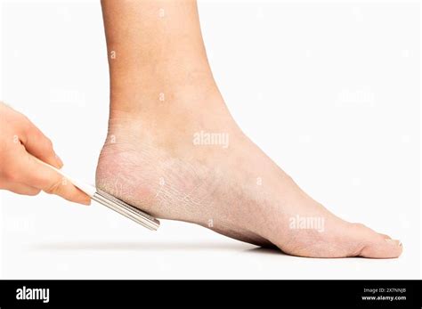 Female Feet Care Clean Heels Woman Having Pedicure To Her Legs With