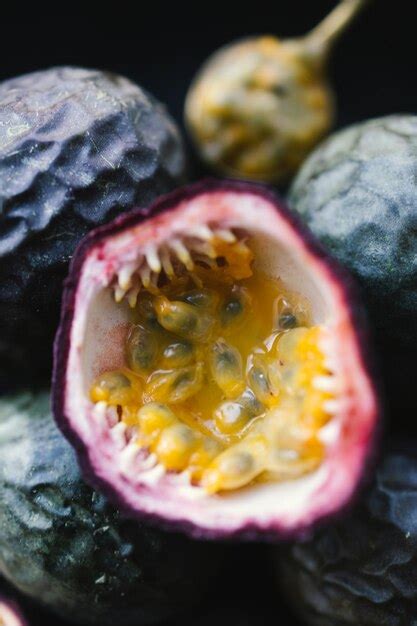 Premium Photo Exotic Passion Fruit On A Moody Background