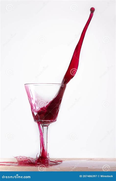 Glass With Spilling Water Splash Side View On White Background
