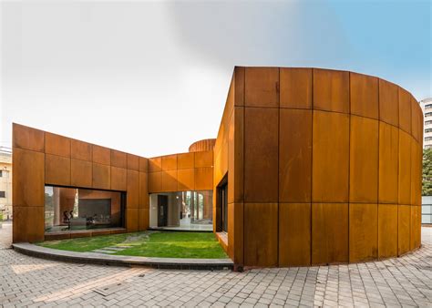 Sanjay Puris Arching Office Building Features Weathering Steel Facades