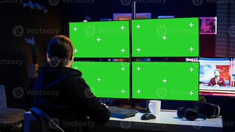 cybercriminal coding on green screen monitors developing zero day