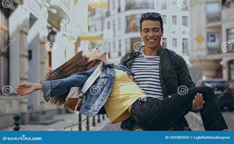Cheerful Bi Racial Man Lifting Girlfriend Stock Image Image Of