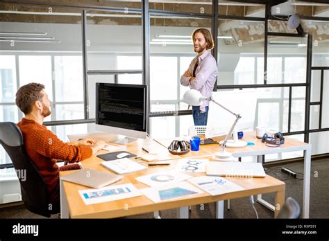 Man As A Programmer Working With Computer Code Sitting At The Beautiful