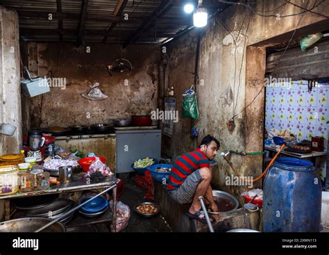 Bangladeshi Man Cooking In A Restaurant Kitchen In Korail Slum Dhaka
