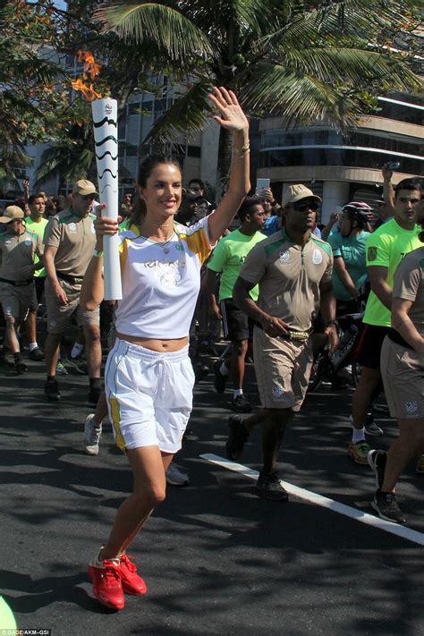 Adriana Lima Carries The Olympic Torch Ahead Of The Rio Olympics 2016 Opening Ceremony Daily