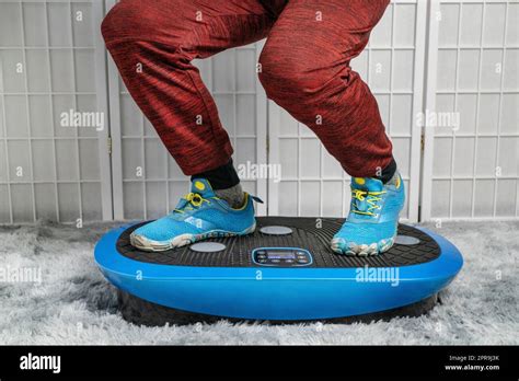Man Standing On A Vibration Plate Exercise Machine Full Body Vibration