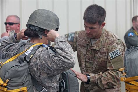 A U S Army Jumpmaster Helps A U S Army Paratrooper Picryl Public