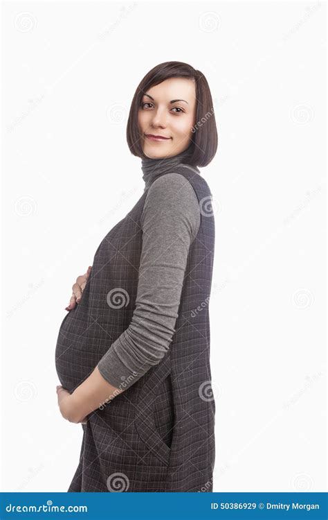 Portrait Of Pregnant Caucasian Woman Standing Isolated Against W Stock