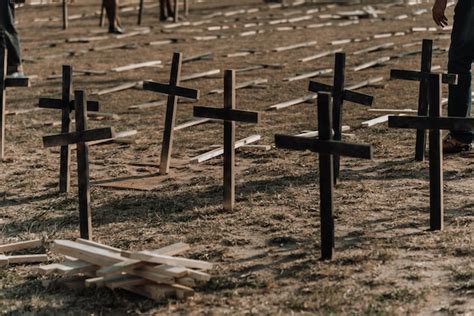 Premium Photo Crosses Fixed To The Ground In Honor Of Those Killed By