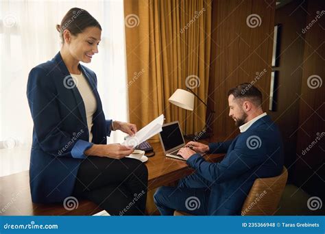 Business Partners Working Together In Hotel Room On Business Trip