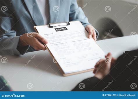 Person Submitting Resume To Interview For A Job With A Company Person Attending A Job Interview