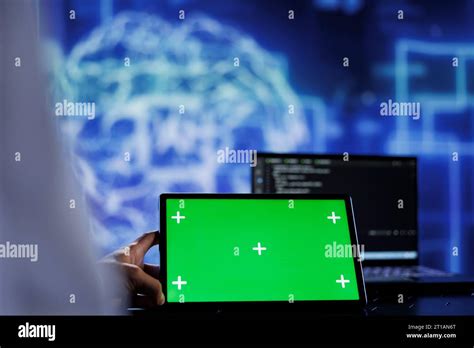 trained admin writes code on mockup tablet to visualize artificial