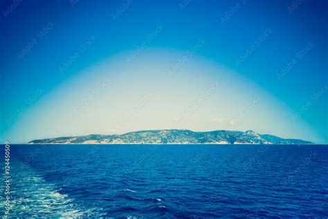Deep Blue Filtered Vignetted Panorama View Of Argentario Peninsula On