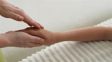 Close Up Hands Of Unrecognizable Female Masseuse Massaging Of Arm