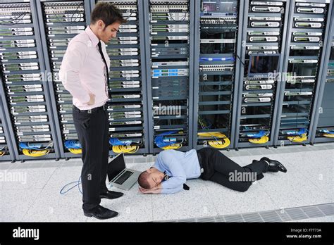 It Business Man In Network Server Room Have Problems And Looking For Disaster Situation Solution