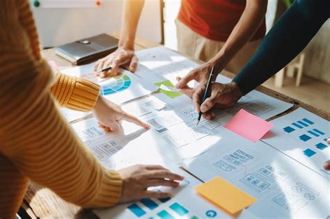 premium photo close up view of ui developer team brainstorming on
