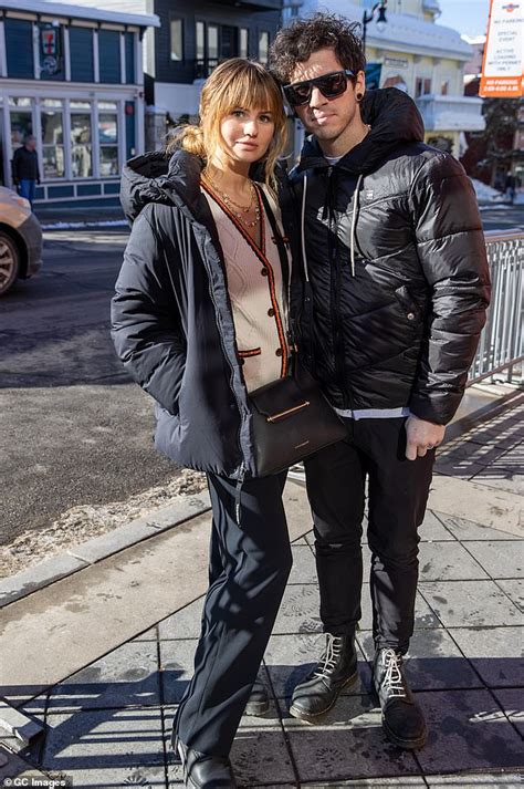 Debby Ryan And Beau Josh Dun Bundle Up In Heavy Black Coats As They