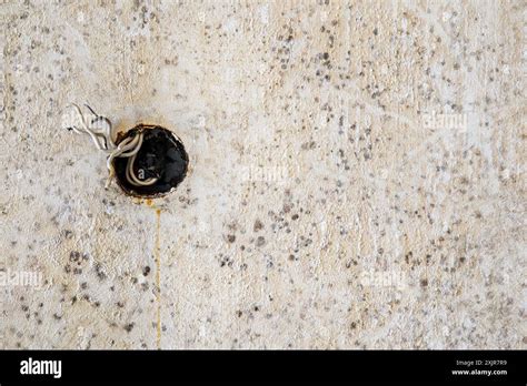 Electrical Wires Sticking Out From Broken Electrical Socket Hole On