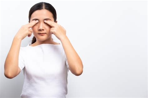Premium Photo Woman With Conjunctivitis Standing Against White Background