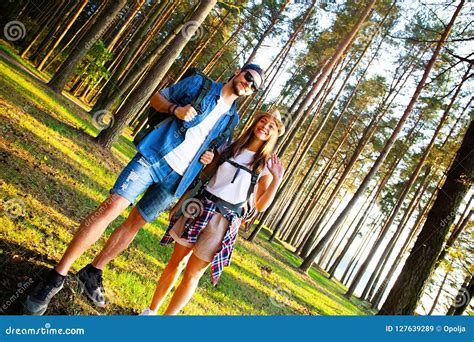 Tough Route Beautiful Young Couple Hiking Together In The Woods While