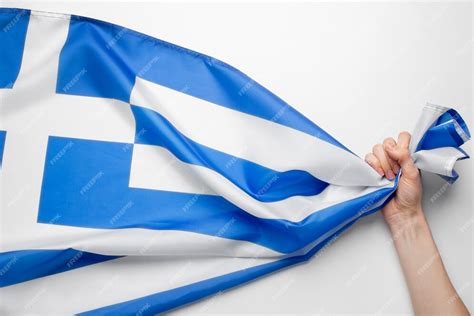 ギリシャの旗生地を持っている手 無料の写真