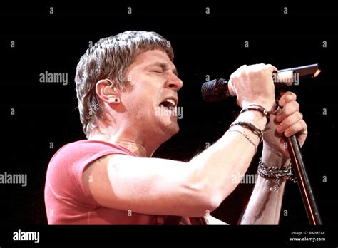 Singer And Songwriter Rob Thomas Is Shown Performing On Stage With His