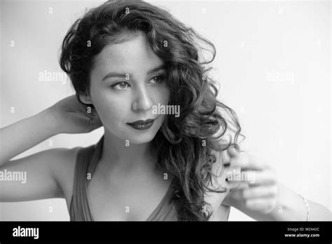 Beautiful Classically Dressed Young Girl Dances Across A Grey Backdrop Isolated Long Dress And