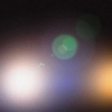 blurred lights and grainy texture overlay on abstract background