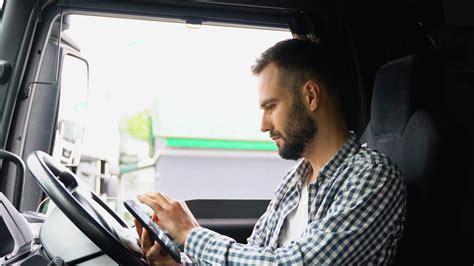 Professional Trucker Using Truck Gps Navigation To Transport And