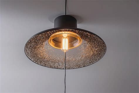 Premium Photo A Light Fixture With A Light Inside