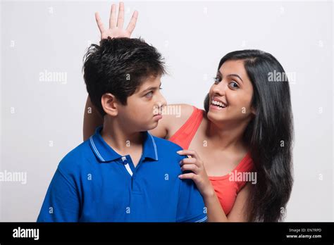 Sister Teasing Her Brother Stock Photo Alamy