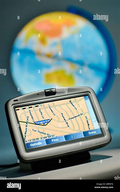 GPS SATELLITE NAVIGATION INSTRUMENT IN FRONT OF GLOBE Stock Photo Alamy