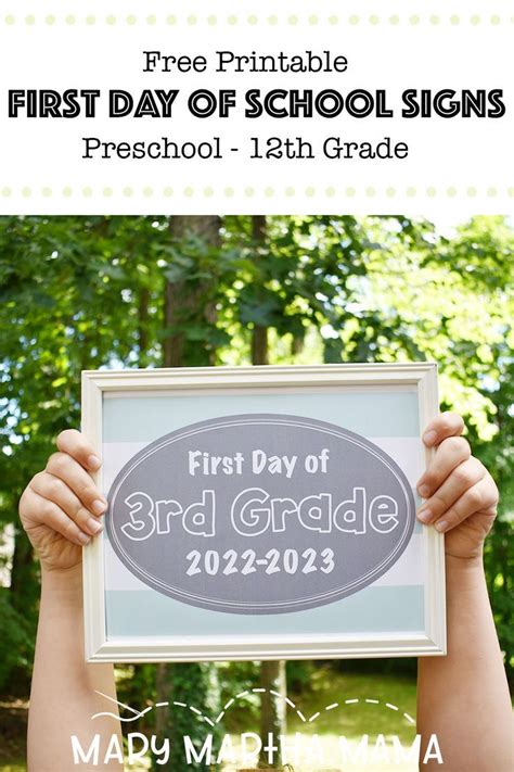 The First Day Of School Sign Is Held Up In Front Of Trees And Grass
