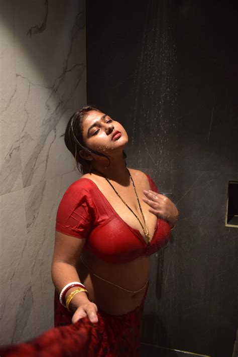 Megha Das Takes A Shower In Red Blouse Which Hides Her Big Milkers