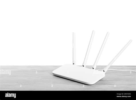 New Modern Wi Fi Router On Light Wooden Table Against White Background Space For Text Stock