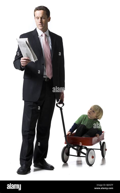 Father Reading A Newspaper Stock Photo Alamy