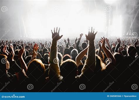 Cheering People Crowd On The Dance Floor During A Music Concert Stock