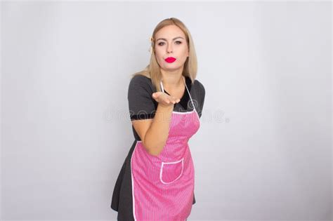 Blonde Woman In Grey Dress Wearing Kitchen White And Ppink Apron Stock