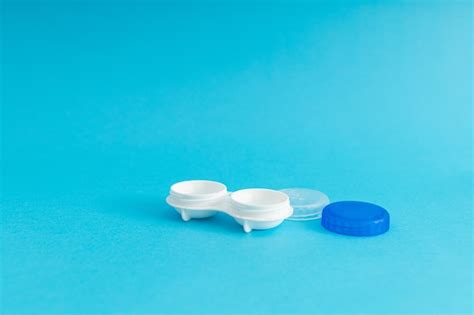 Premium Photo Eye Lens Case On Blue Background