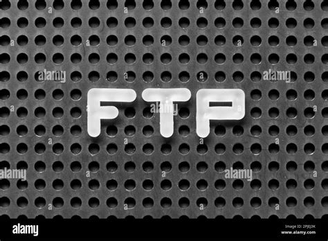 White Alphabet Letter In Word Ftp Abbreviation Of File Transfer Protocol On Black Pegboard