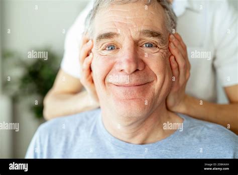 A Modern Rehabilitation Physiotherapy Worker With Senior Client Stock