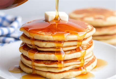 Creative Maple Syrup Into Pancake Stack A Thick Golden Maple Syr Stock