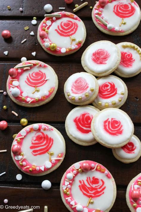 Rose Cookies Decorated On A Sugar Cookie Recipe With Royal Icing