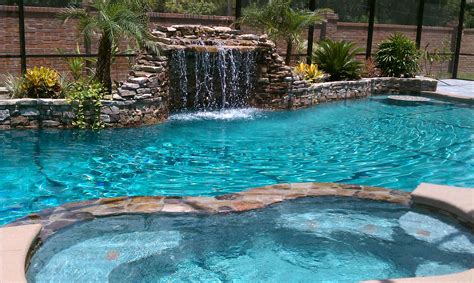 Pool With Spa And Rock Waterfall Pool Pool Builders Custom Swimming