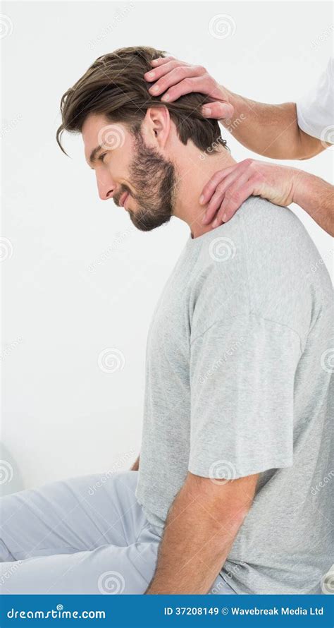 Side View Of A Man Getting The Neck Adjustment Done Stock Image Image