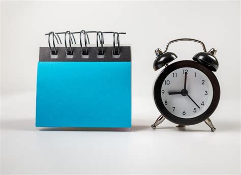 Premium Photo Blank Sticker And Alarm Clock Planning Concept Place For Text Copy Space Paper