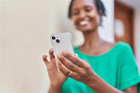 Middle Age African American Woman Smiling Confident Using Smartphone At