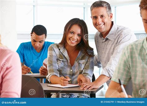 Tutor Helping Student In Class Stock Image Image Of Camera Class 21042791