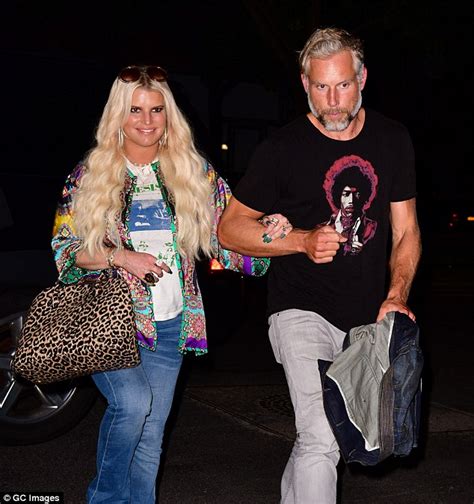 Jessica Simpson Flashes Some Thigh In Boots And Floral Mini In Nyc